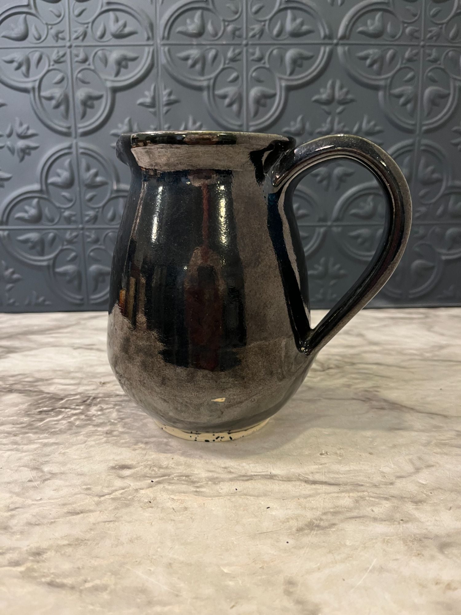 Black glazed pottery pitcher – makememoderndecor